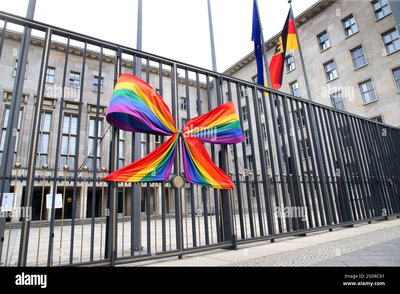 Berlin, Germany. 29th June, 2021. An oversized bow in rainbow colours ...