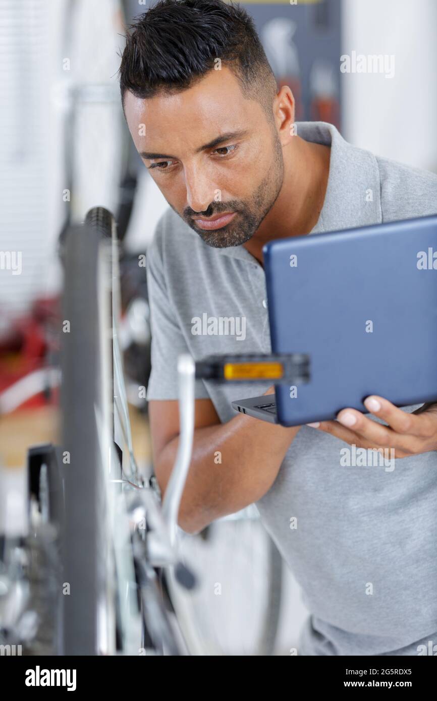 Checking his cycle computer hi-res stock photography and images - Alamy