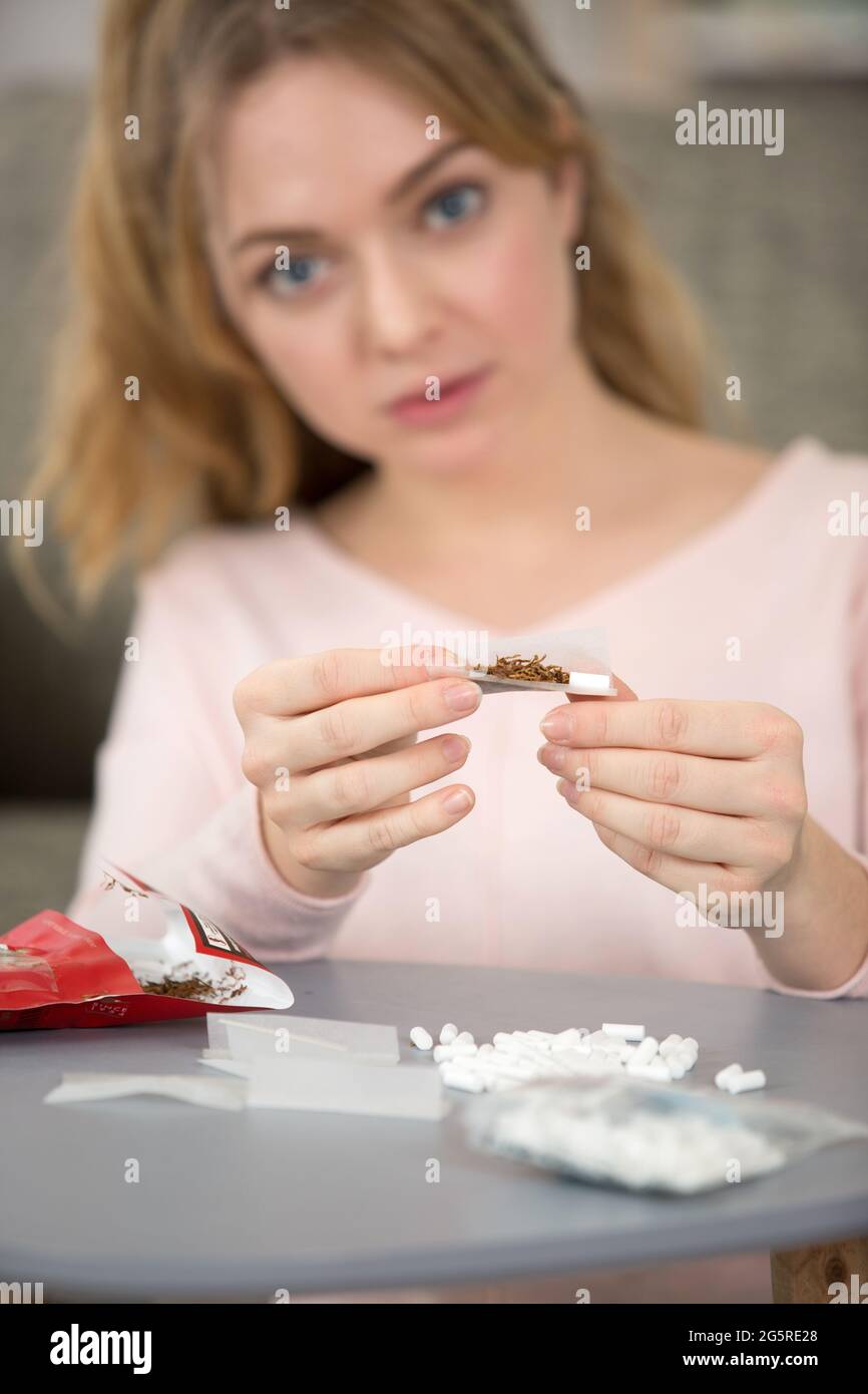 Girl rolling joint hi-res stock photography and images - Alamy