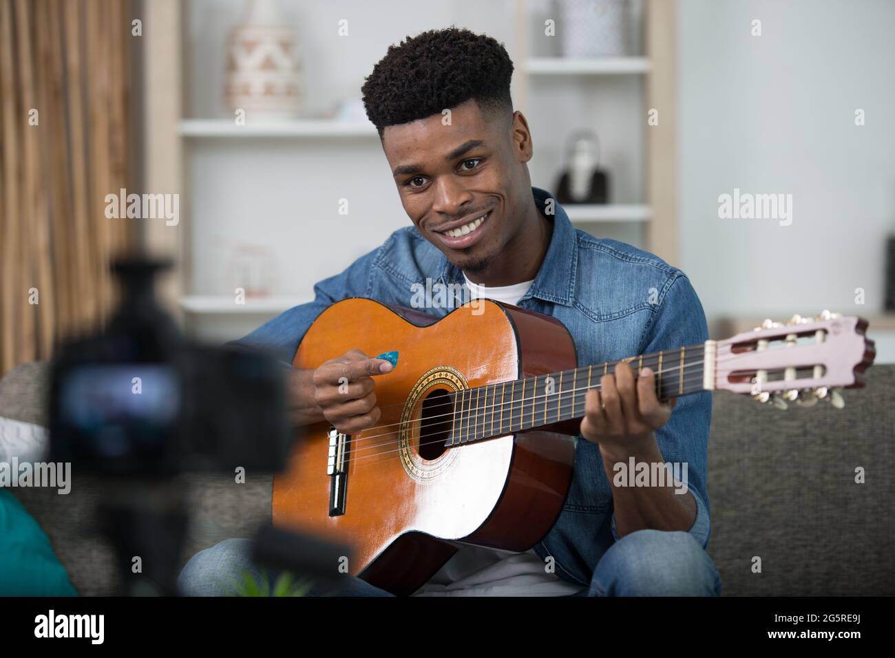 African american vlogger recording video hi-res stock photography and ...