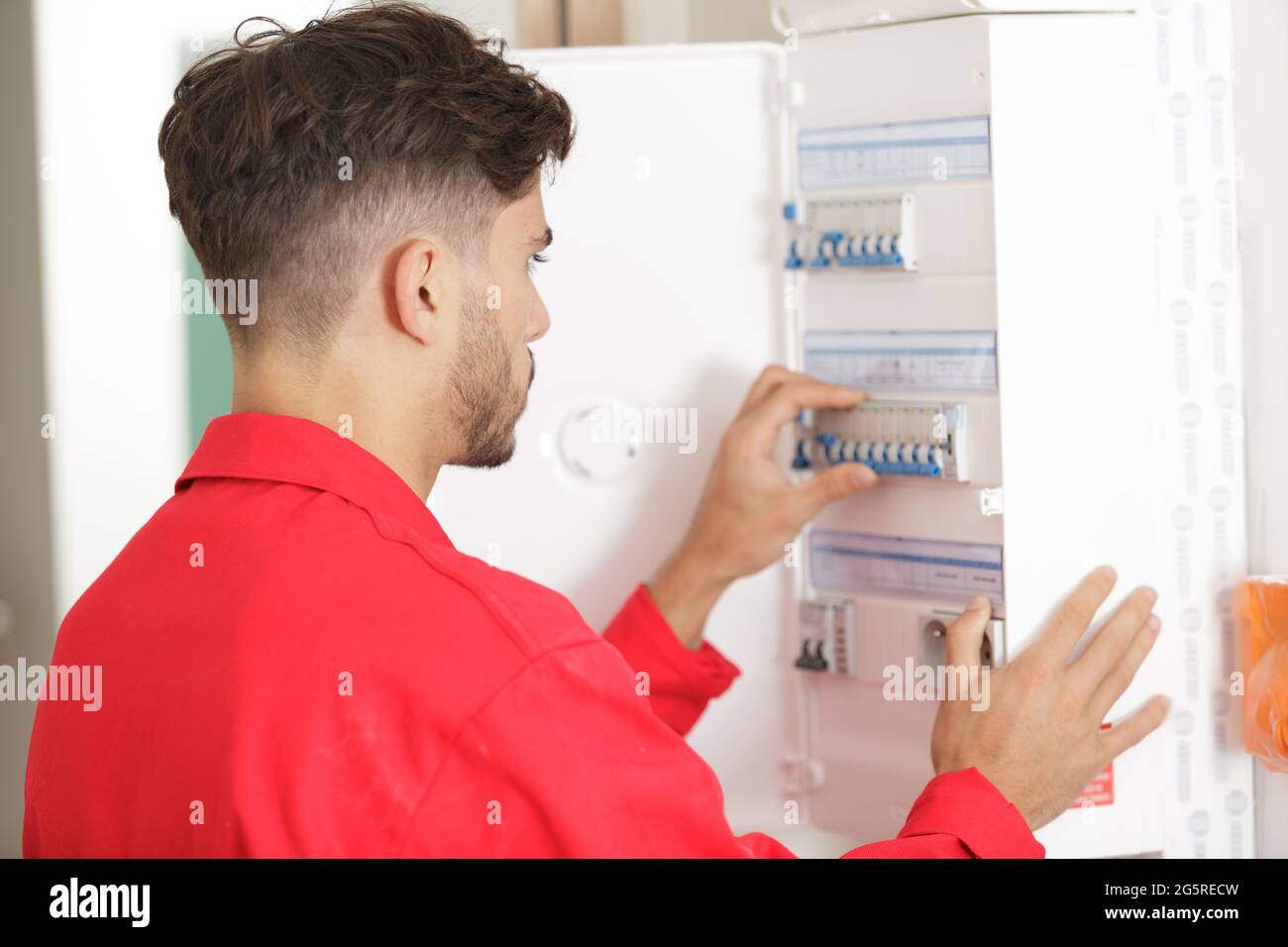 electrician installing energy saving meter Stock Photo - Alamy