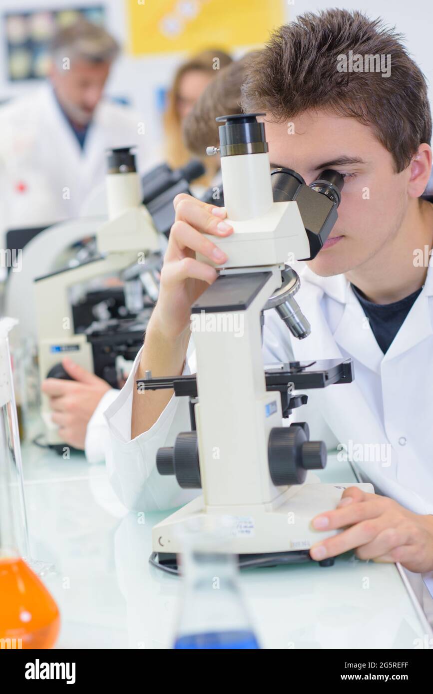 Male scientist using microscope hi-res stock photography and images - Alamy