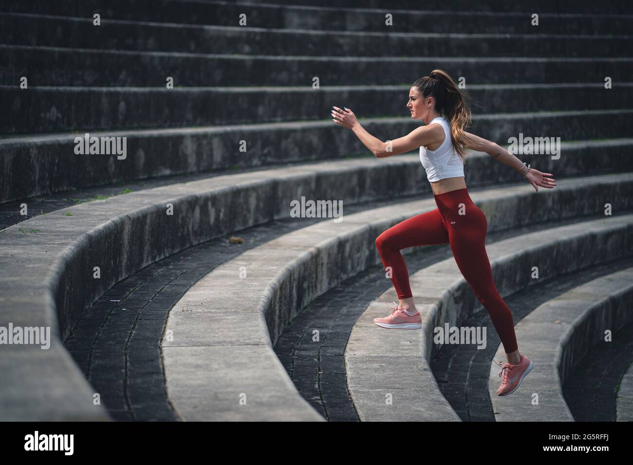 Athlete girl doing running up stairs, it is her lifestyle Stock Photo ...
