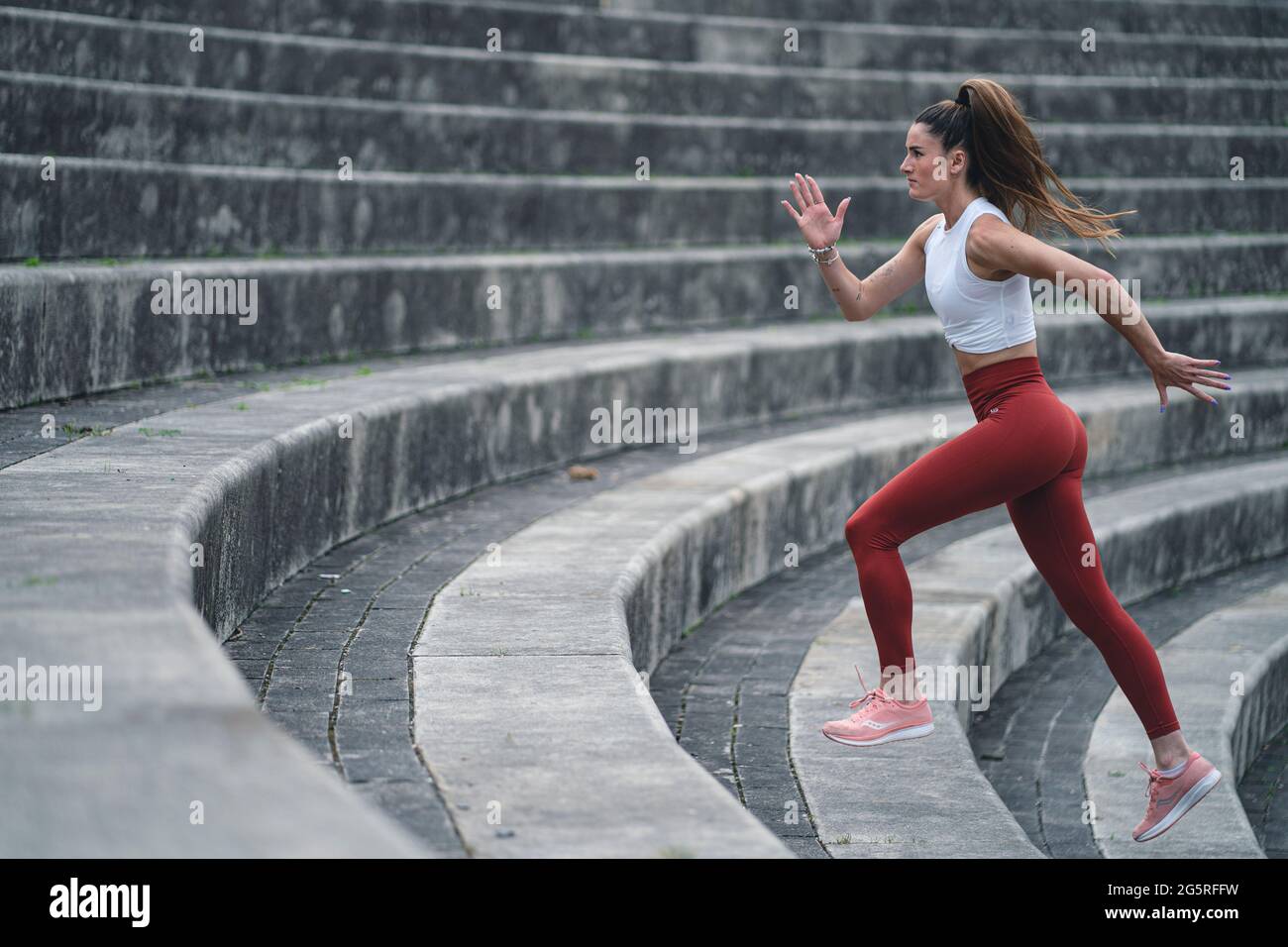 Athlete girl doing running up stairs, it is her lifestyle Stock Photo ...
