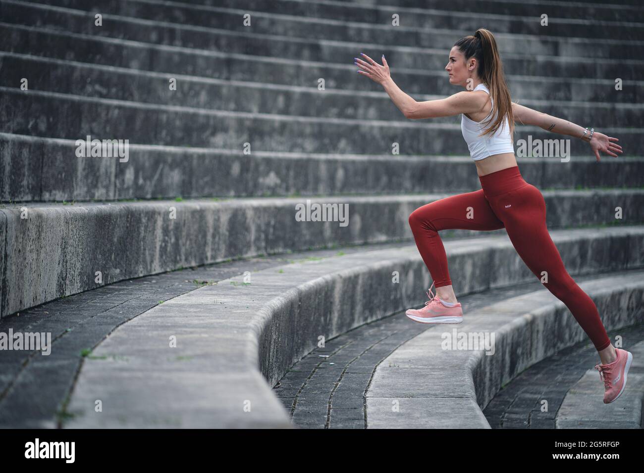Athlete girl doing running up stairs, it is her lifestyle Stock Photo ...