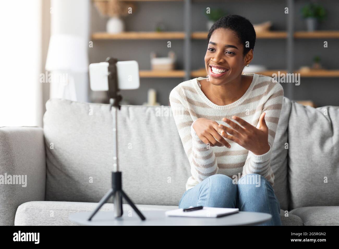 Female video blogger recording mobile hi-res stock photography and ...