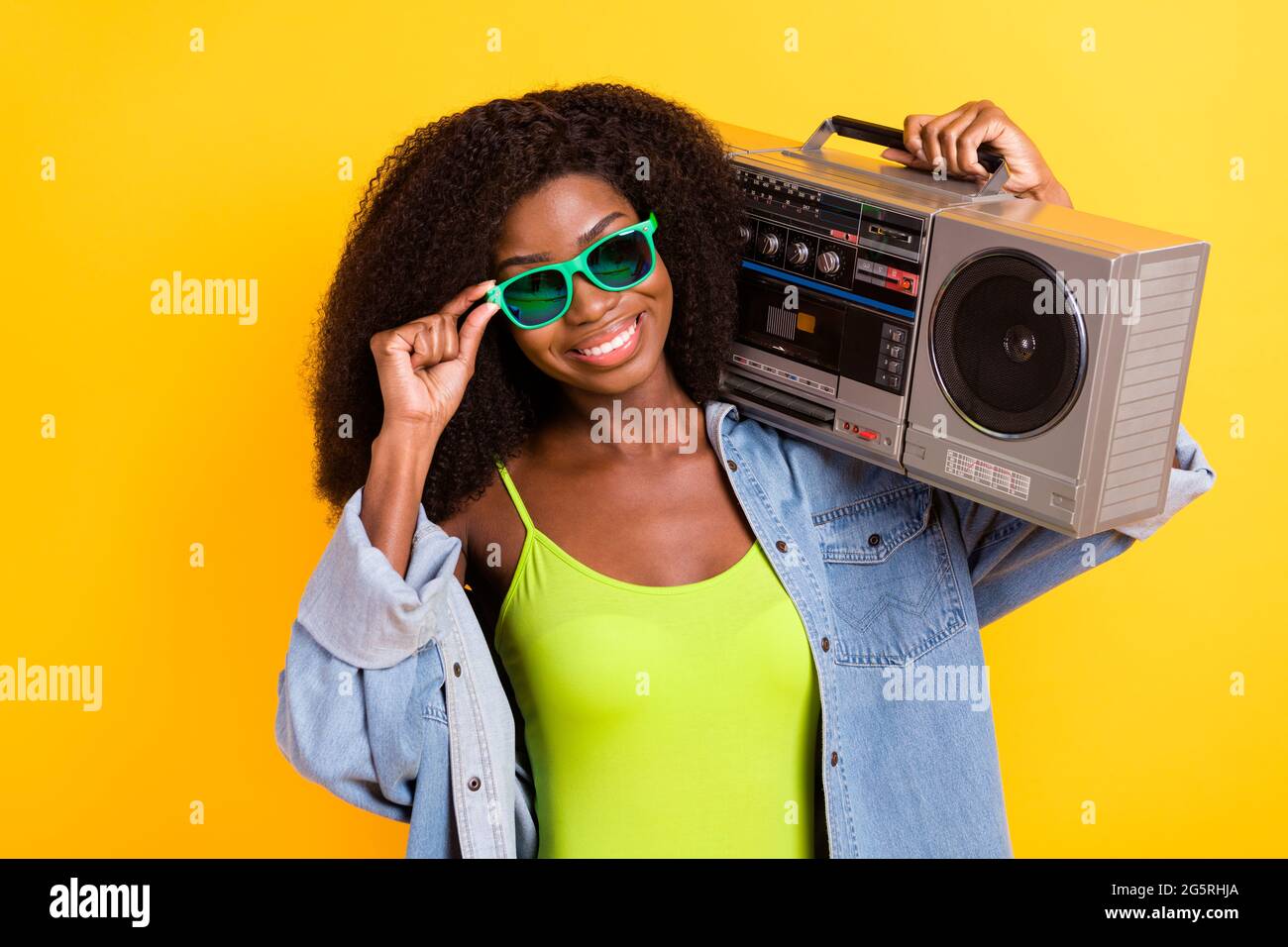 Photo portrait of woman keeping boom box at party wearing stylish ...
