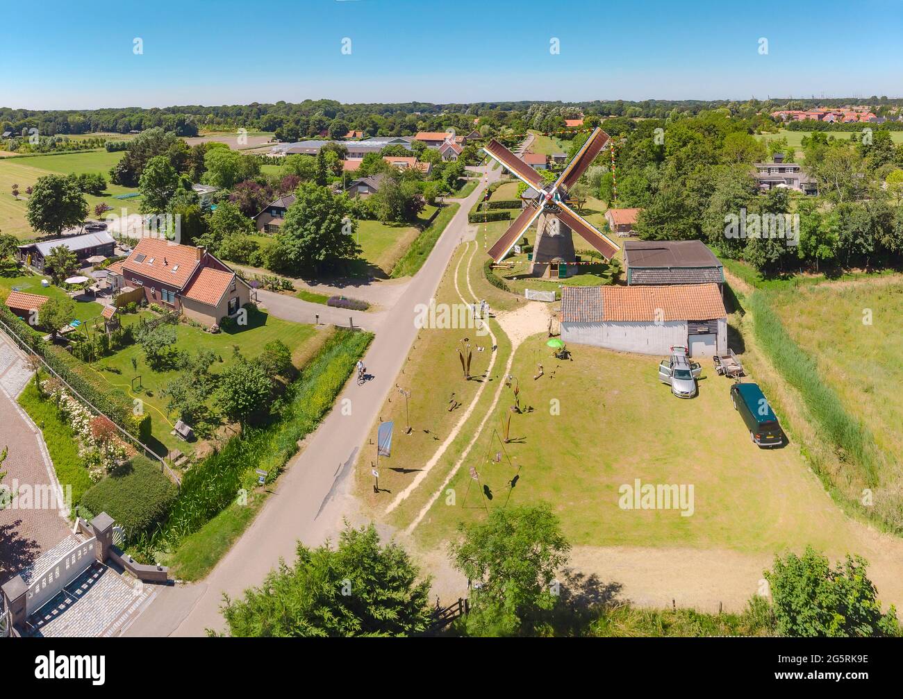 Wheat grinding windmill Stock Photo - Alamy