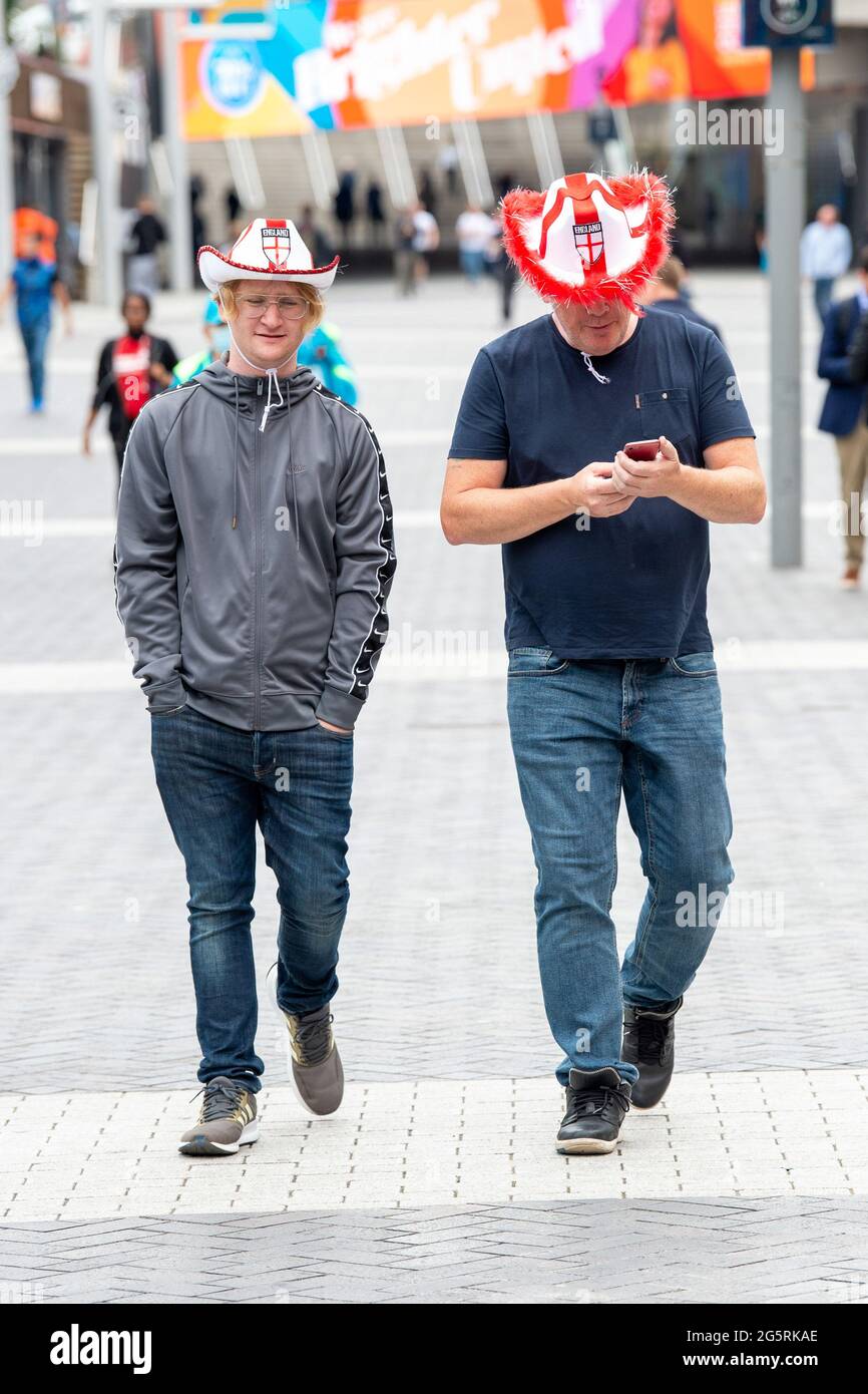 London, UK. 29th June, 2021. Two England fans arriving at Wembley ...