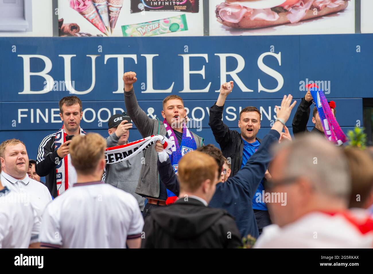 London, UK. 29th June, 2021. England fans cheer outside Wembley Stadium ...