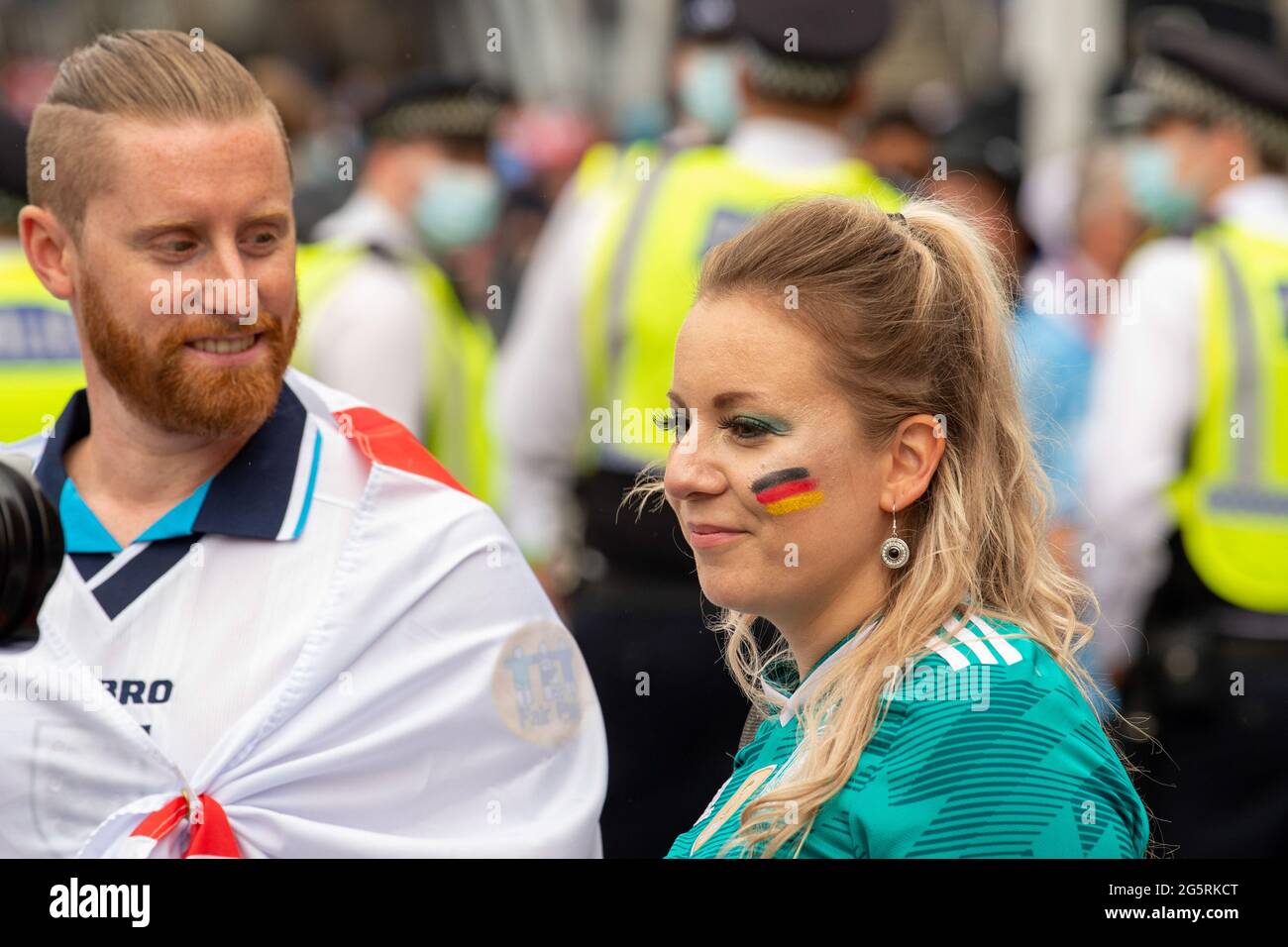 London, UK. 29th June, 2021. An England and German fan arrive together ...