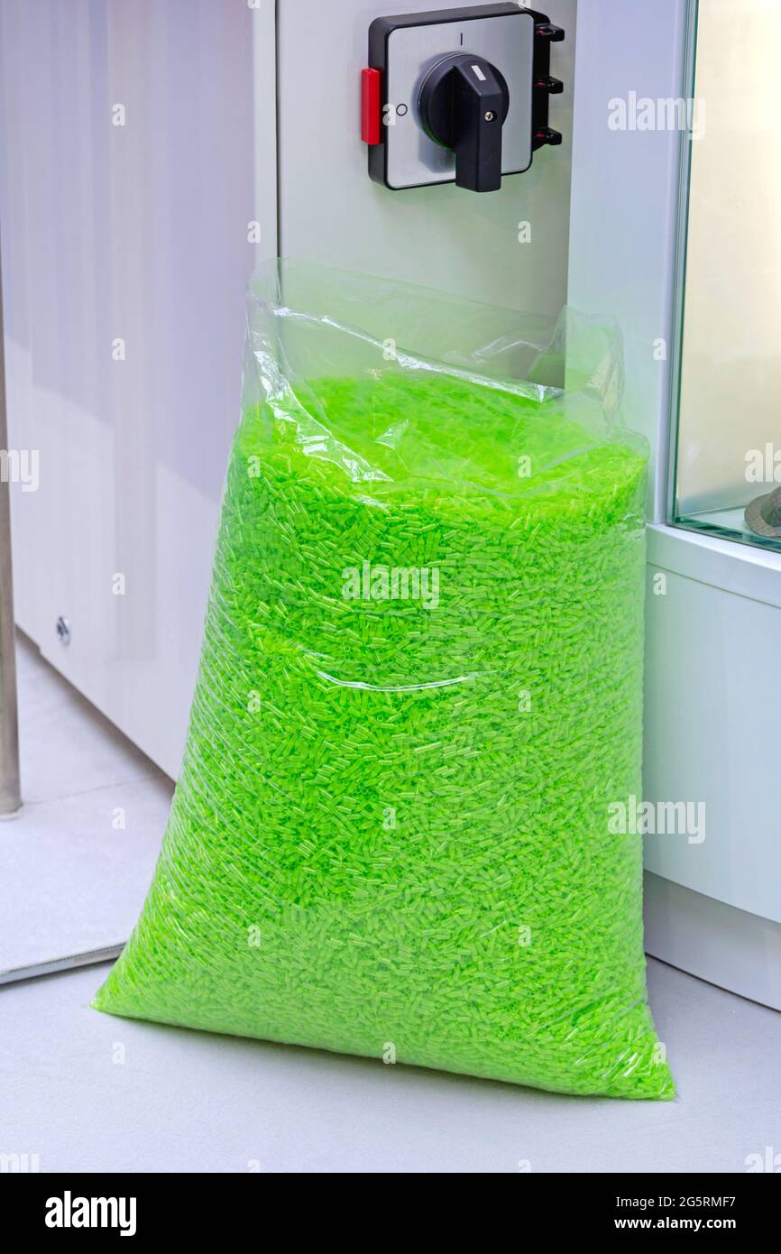 New Green Plastic Parts in Big Sack Machine Production Stock Photo - Alamy