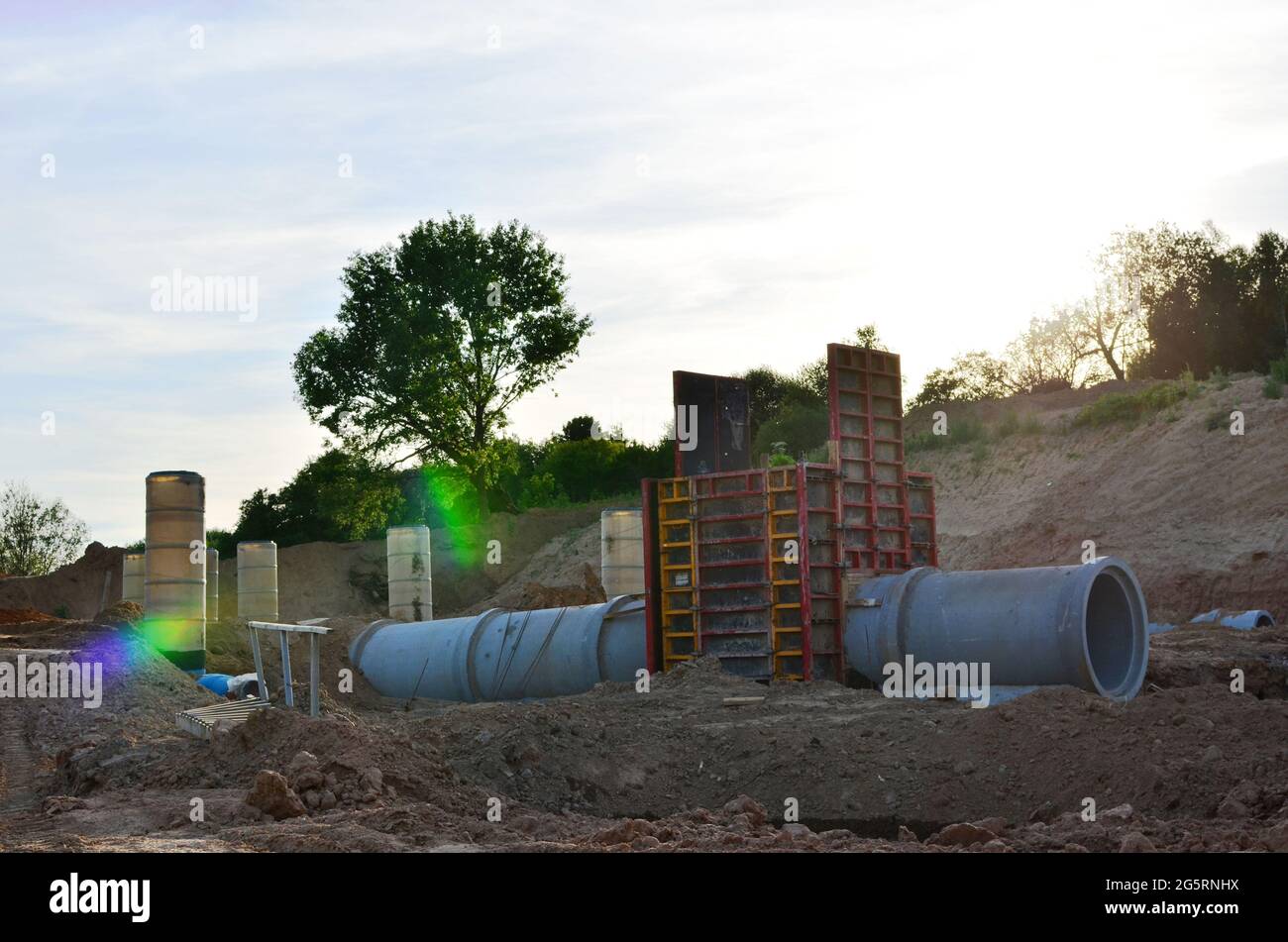 Laying of underground storm sewer pipes. Installation of water main ...