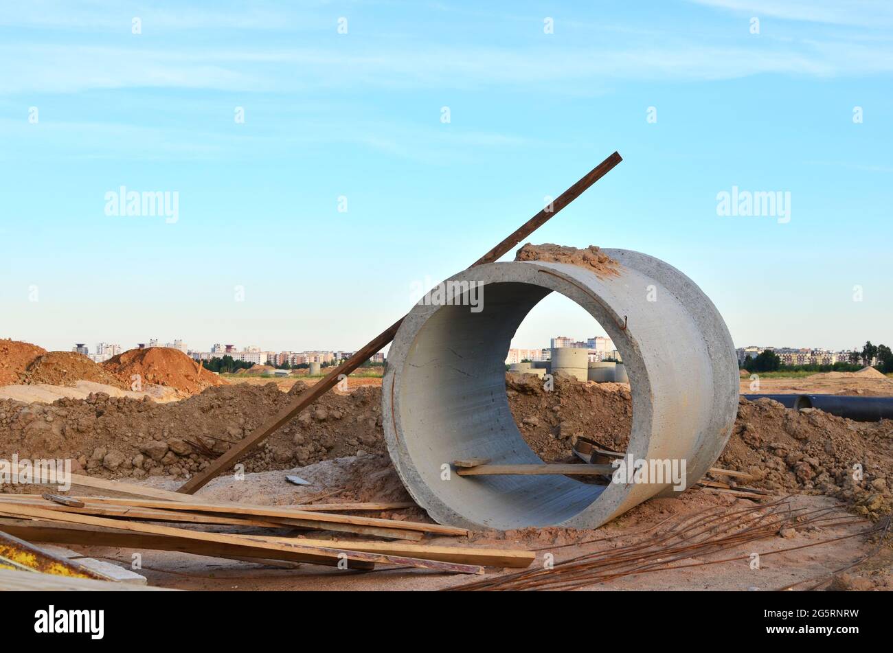 Laying of underground storm sewer pipes. Installation of water main ...