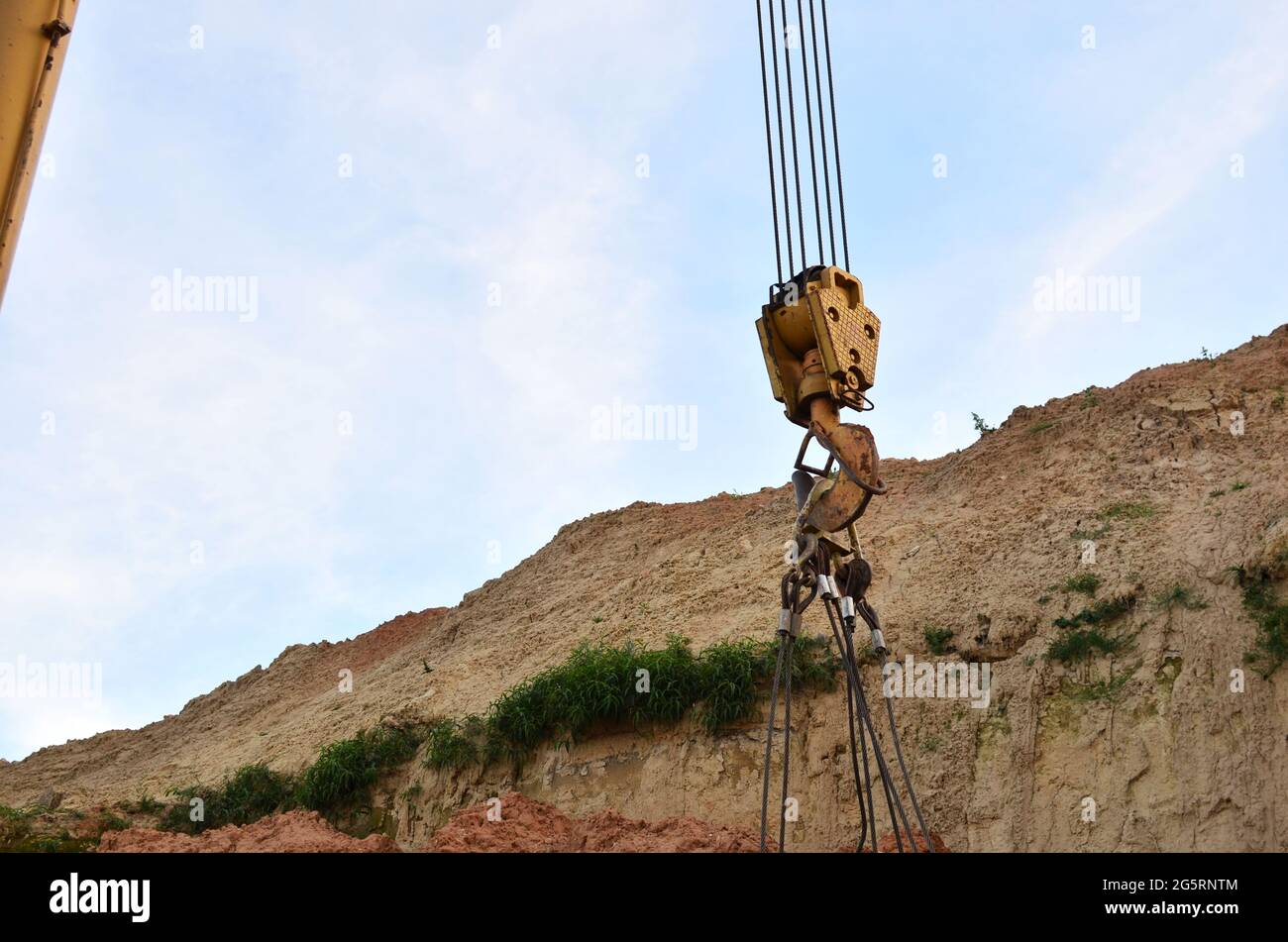 Yellow lifting telescopic arms with hook mobile crane on a background ...