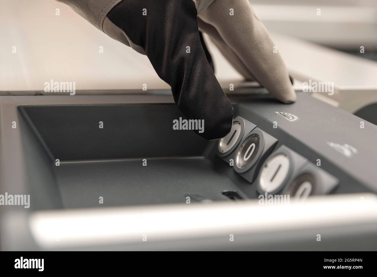 Hand presses the power button of a woodworking machine at a factory ...