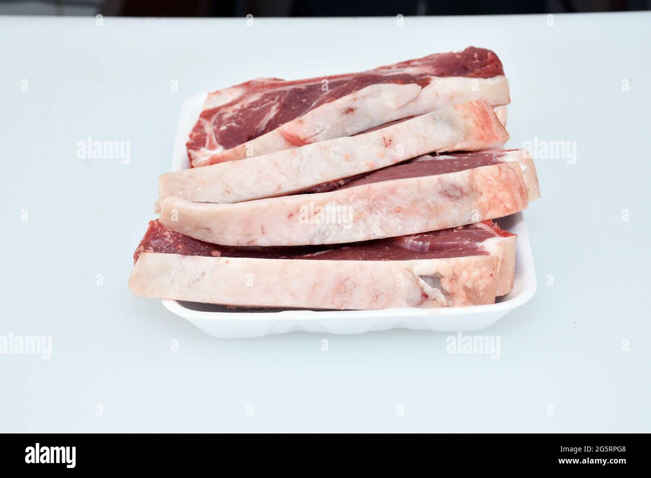 lamb leg steaks in plate on white background,raw mutton meat,organic ...