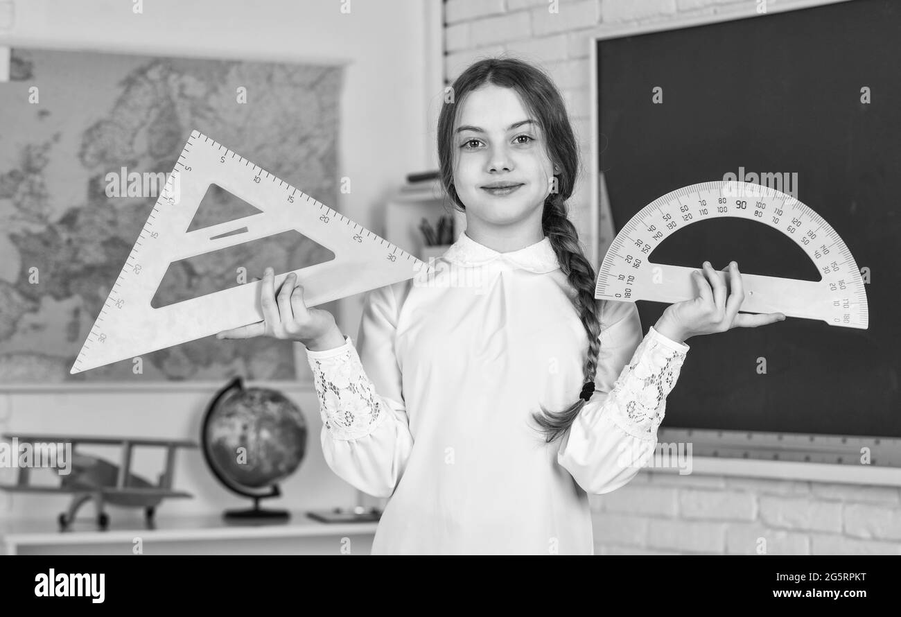 Geometry favorite subject. measure angles in degrees. Small child girl ...