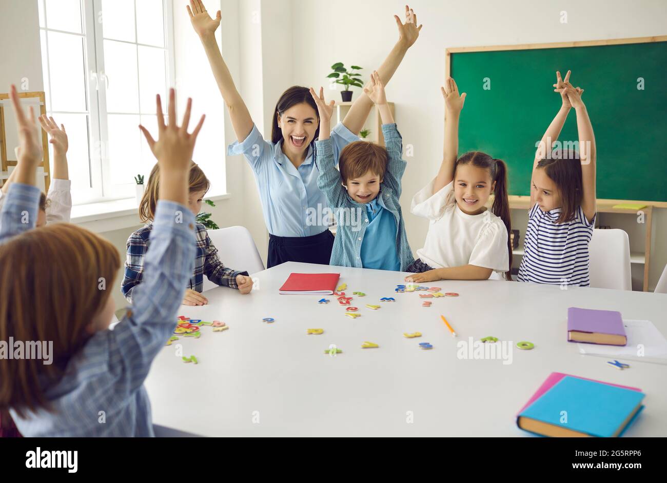 Preschool group performs the task together with the teacher Stock Photo ...