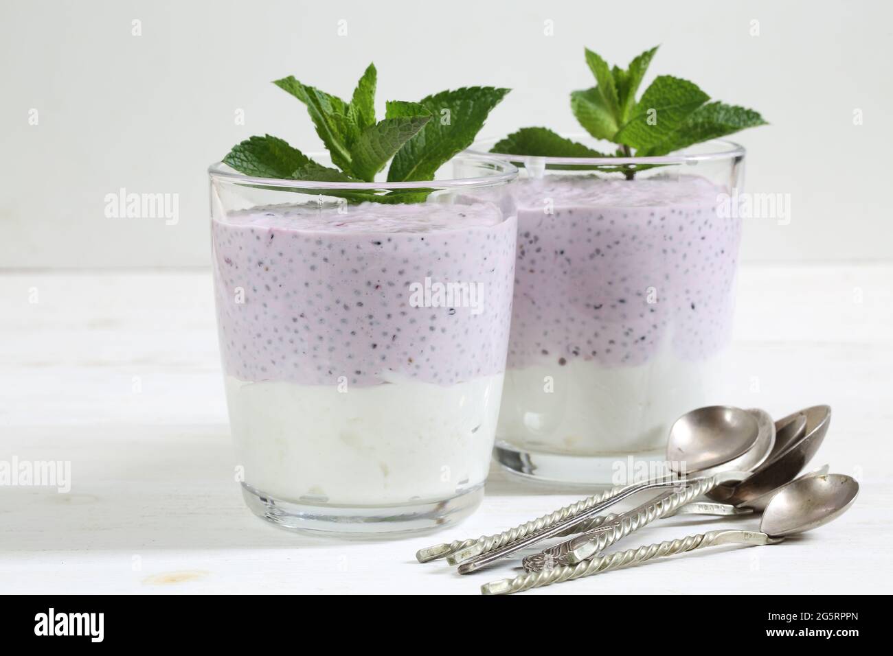 Curd dessert with chia and mulberry on white plate Stock Photo - Alamy