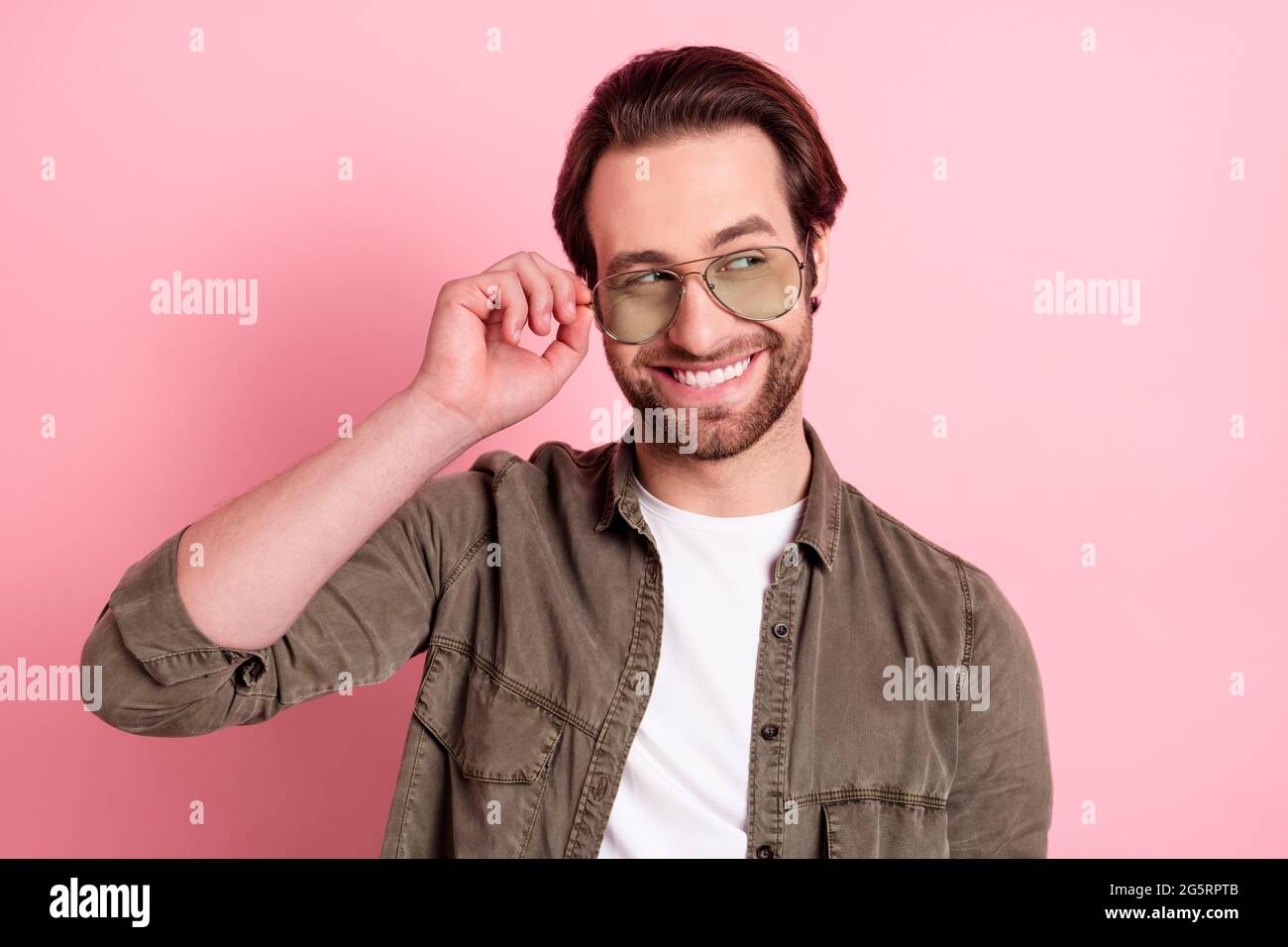 Photo of young cheerful man happy positive smile flirty curious look ...