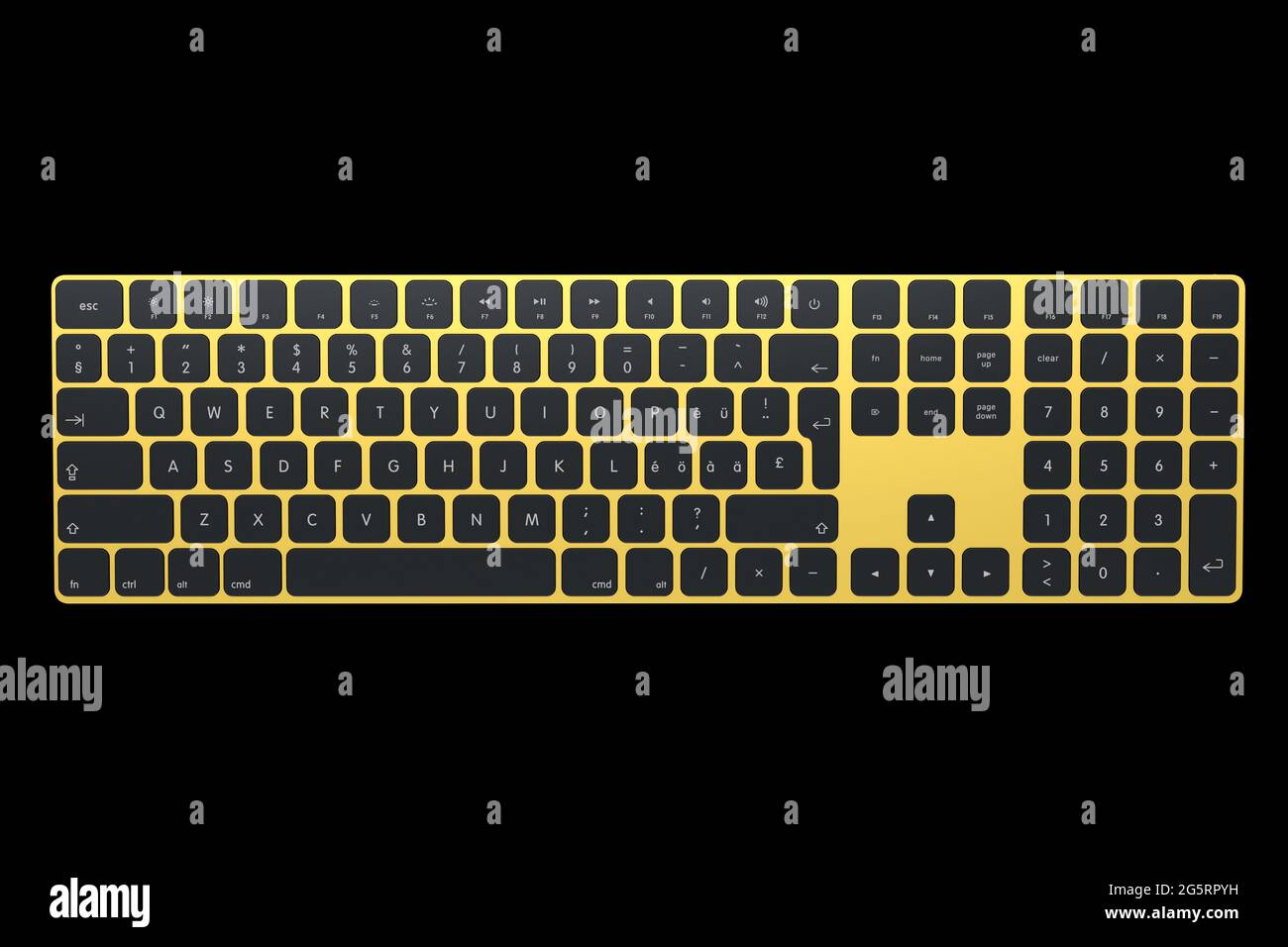 Modern gold aluminum computer keyboard isolated on black background ...