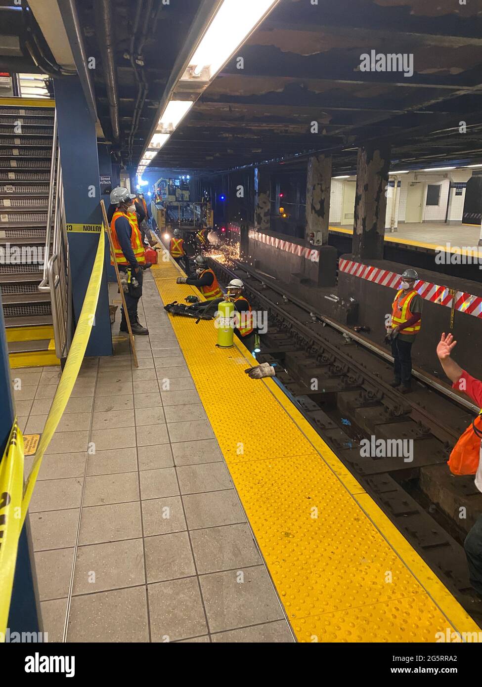 MTA workers lay new track at the Church Avenue Station in the ...