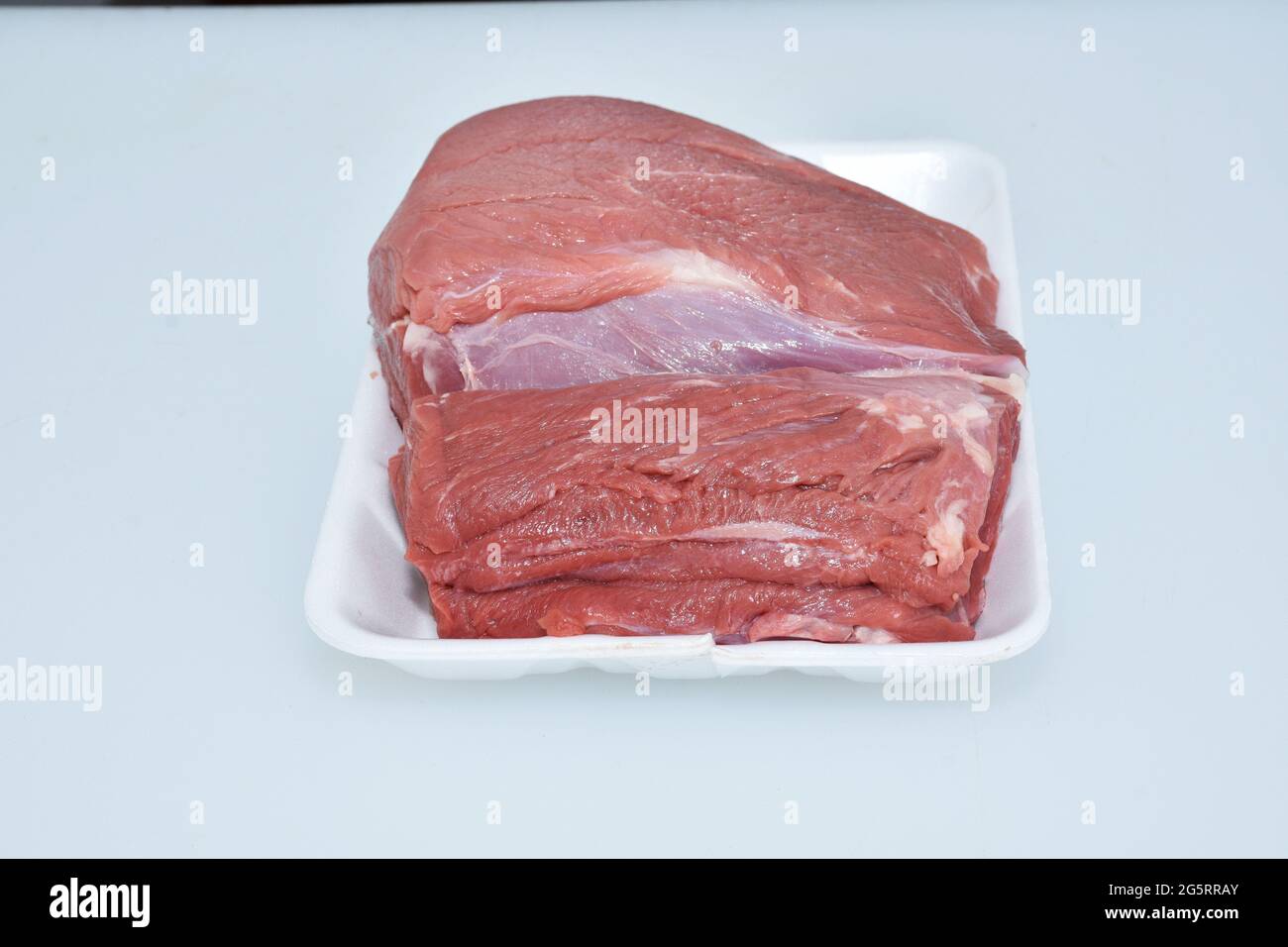 lamb thick flank boneless meat in plate on white background,butcher cut ...