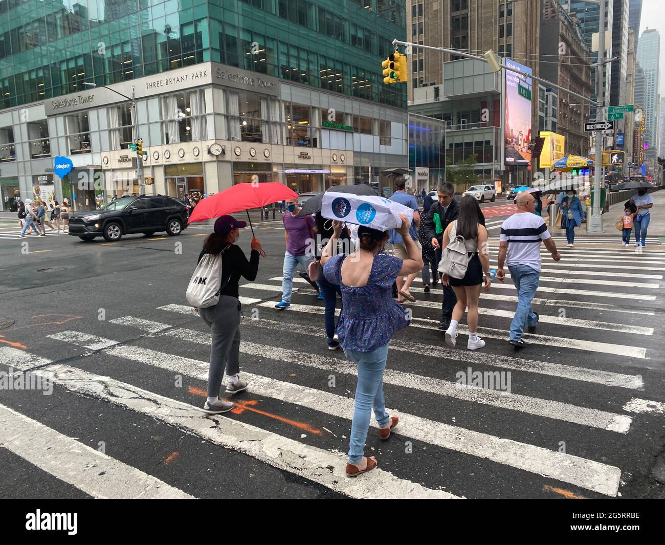 People getting wet by a surprise shower along 42nd Street in midtown ...