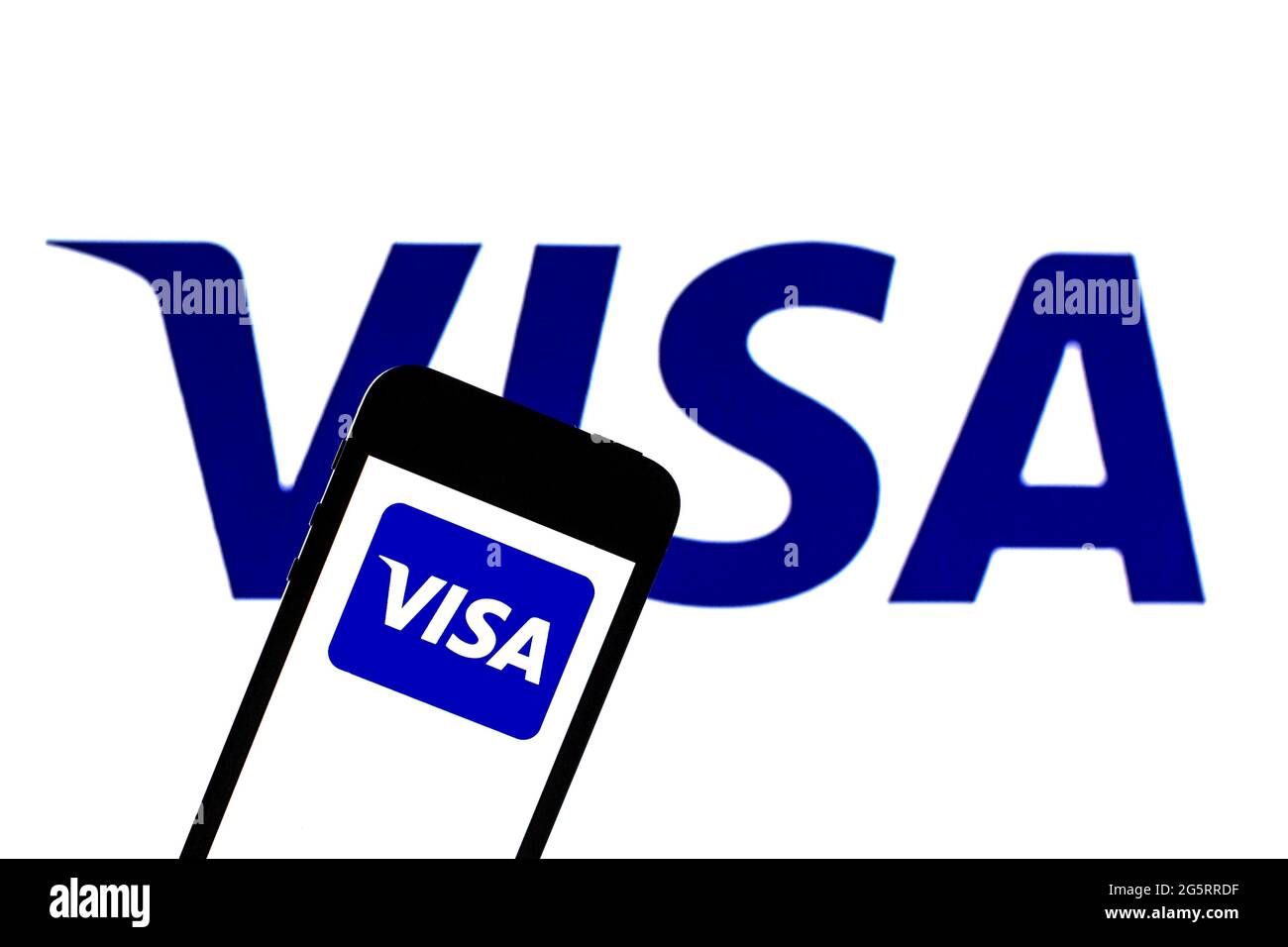 In this photo illustration a Visa Inc. logo seen displayed on a ...