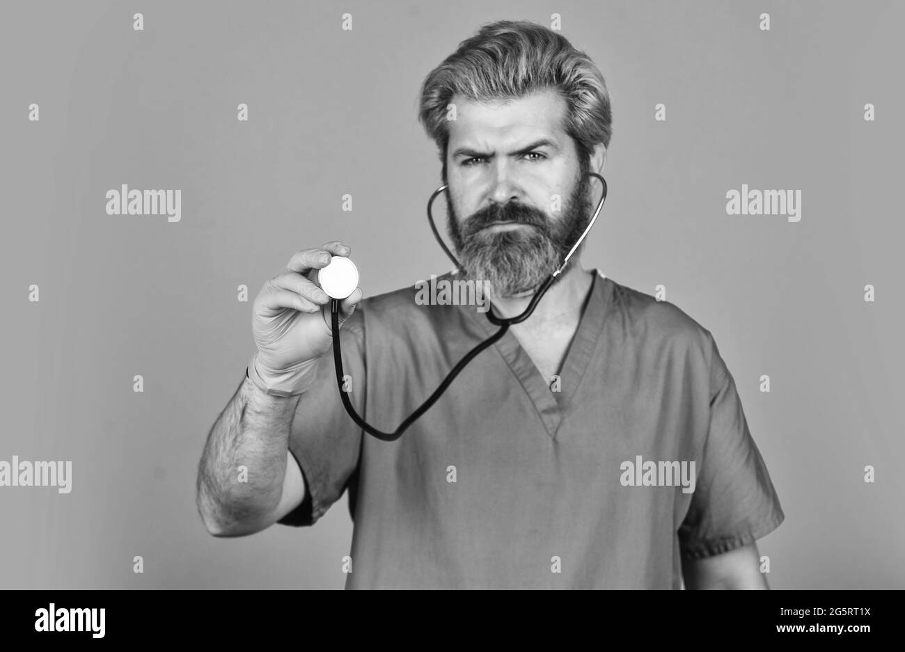 Stay healthy. Doctor with stethoscope at hospital. Bearded man doctor ...