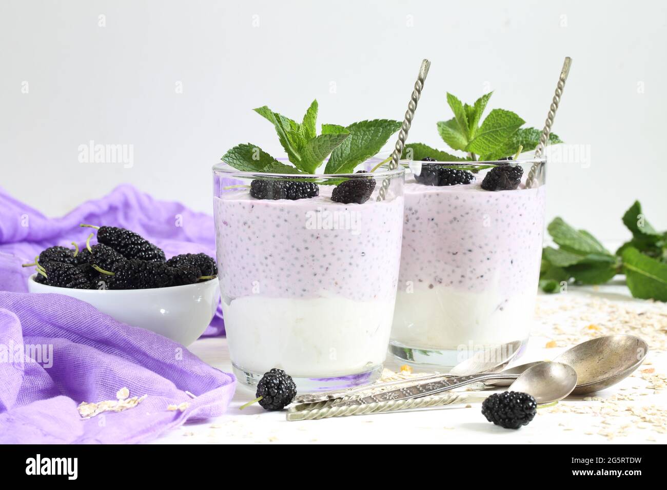 Curd dessert with chia and mulberry on white plate Stock Photo - Alamy