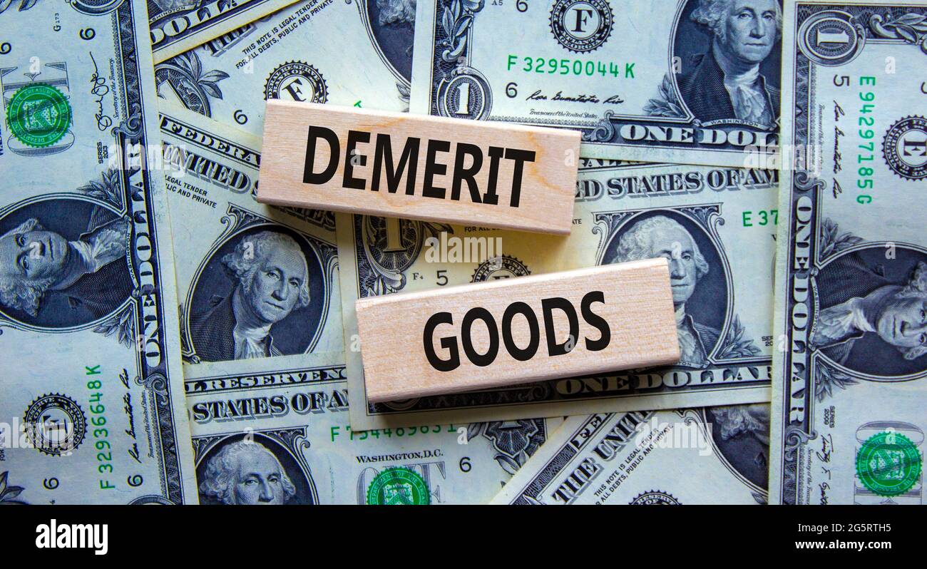 Demerit goods symbol. Wooden blocks with words Demerit goods on ...