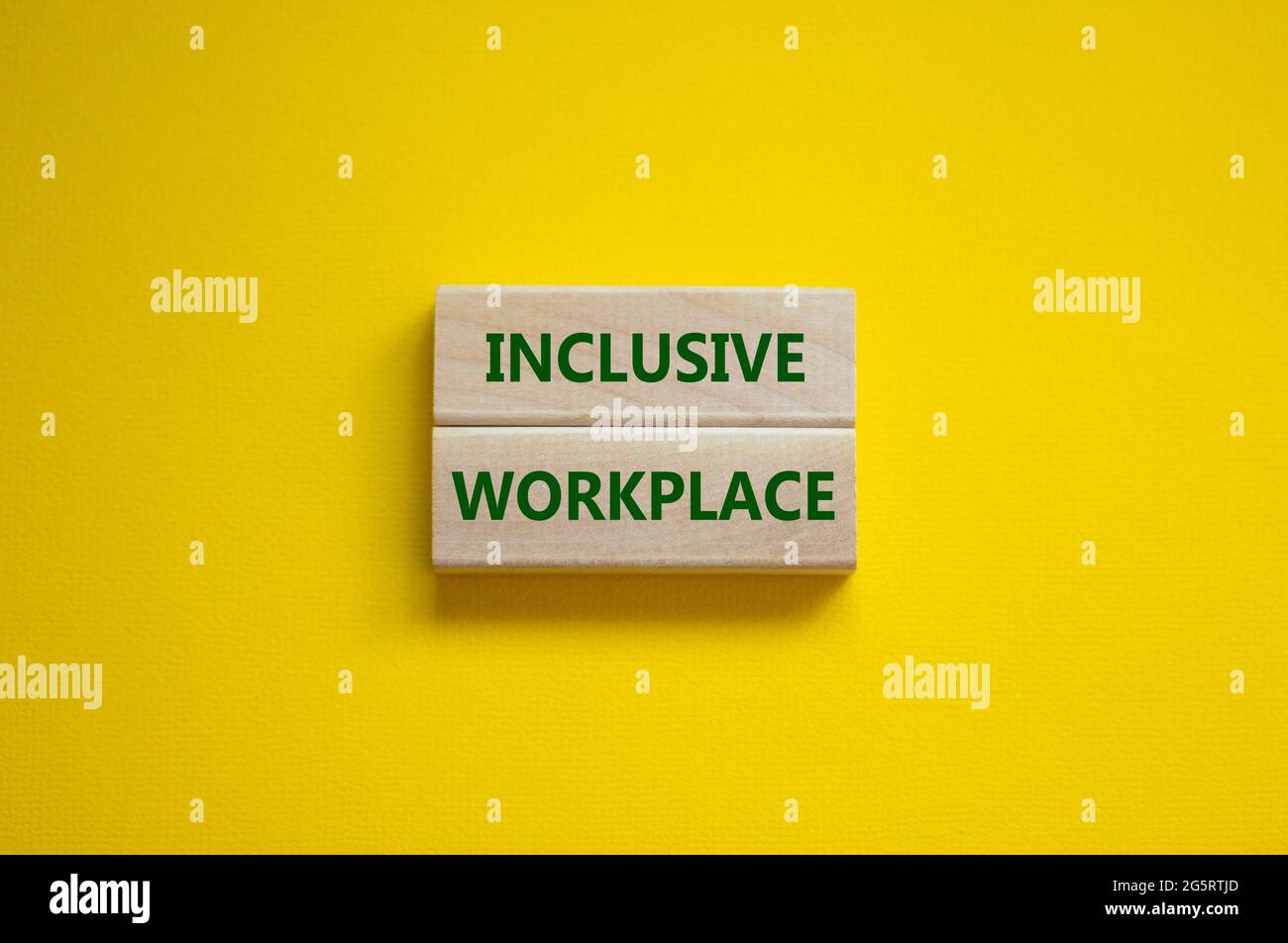 Inclusive workplace symbol. Wooden blocks with words Inclusive ...