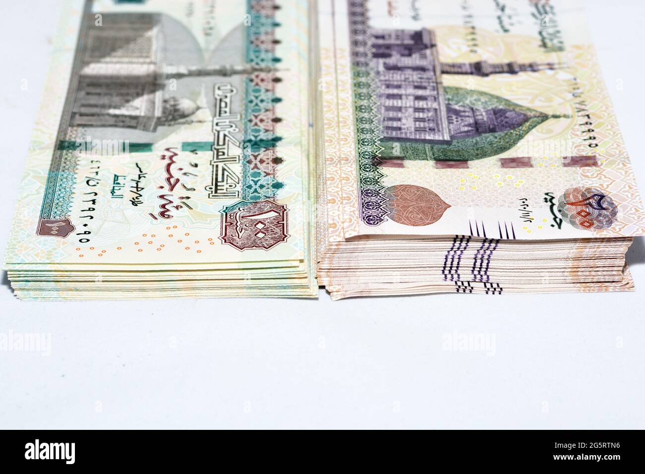 Stacks of 200 and 100 Egyptian pounds banknotes obverse side of 200 LE ...