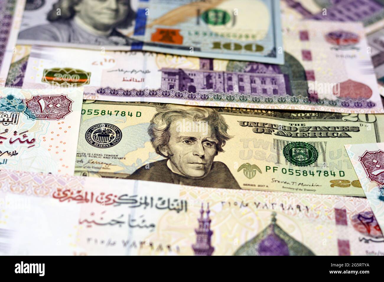 Egypt national currency with USA dollar banknote backdrop. Money ...