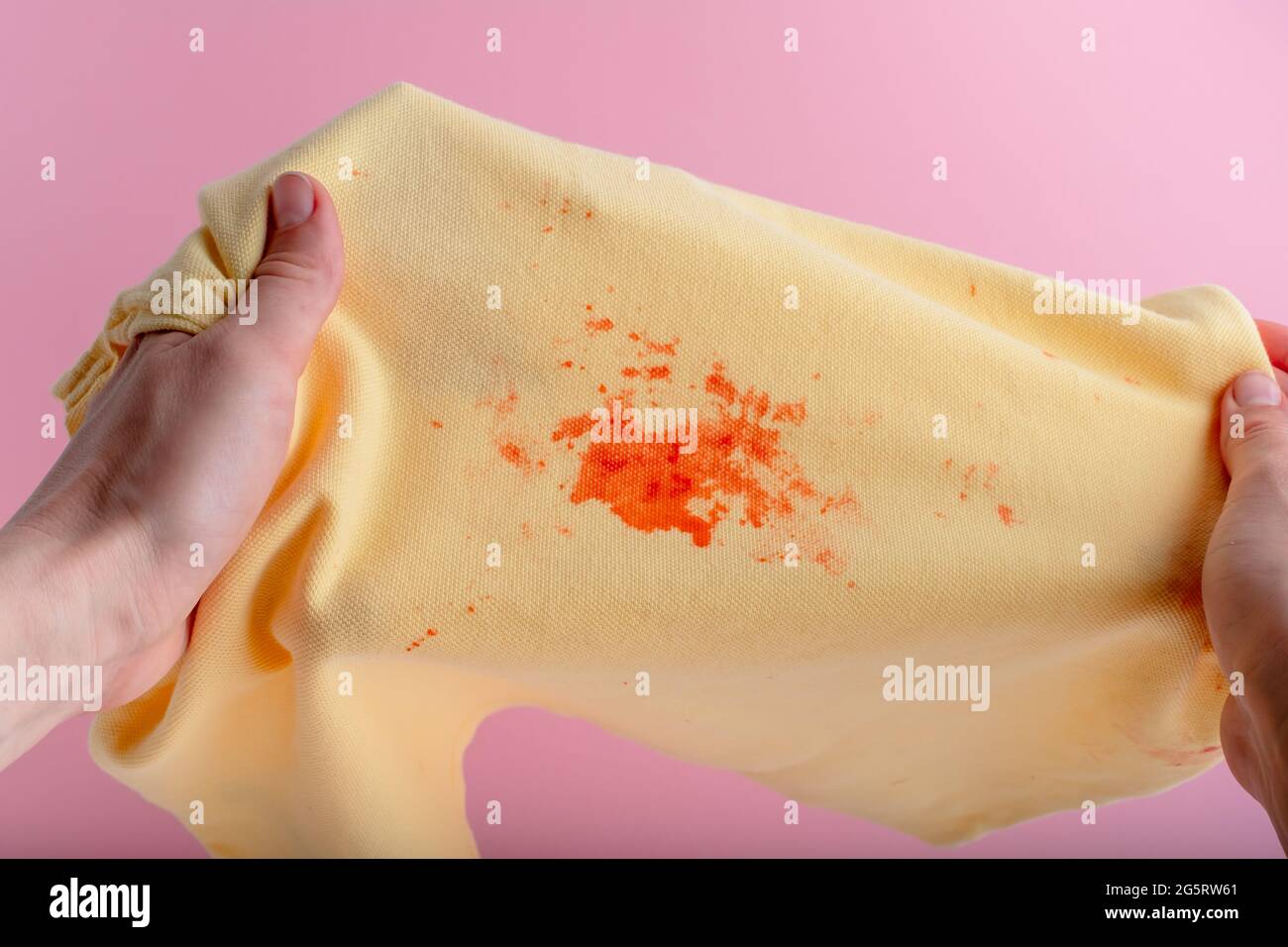 Female hands showing bright stain on clothes. daily life dirty stain ...