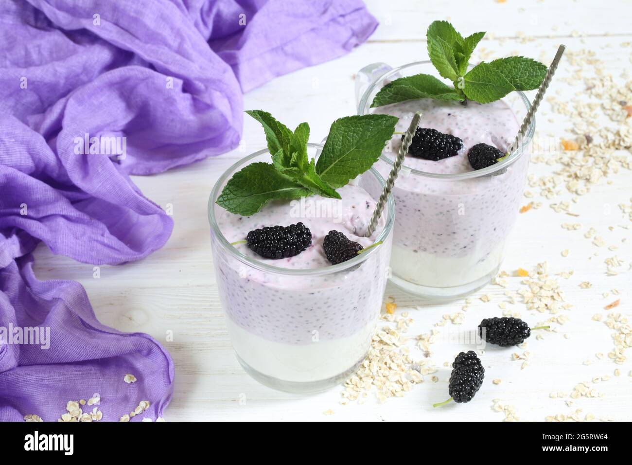 Curd dessert with chia and mulberry on white plate Stock Photo - Alamy