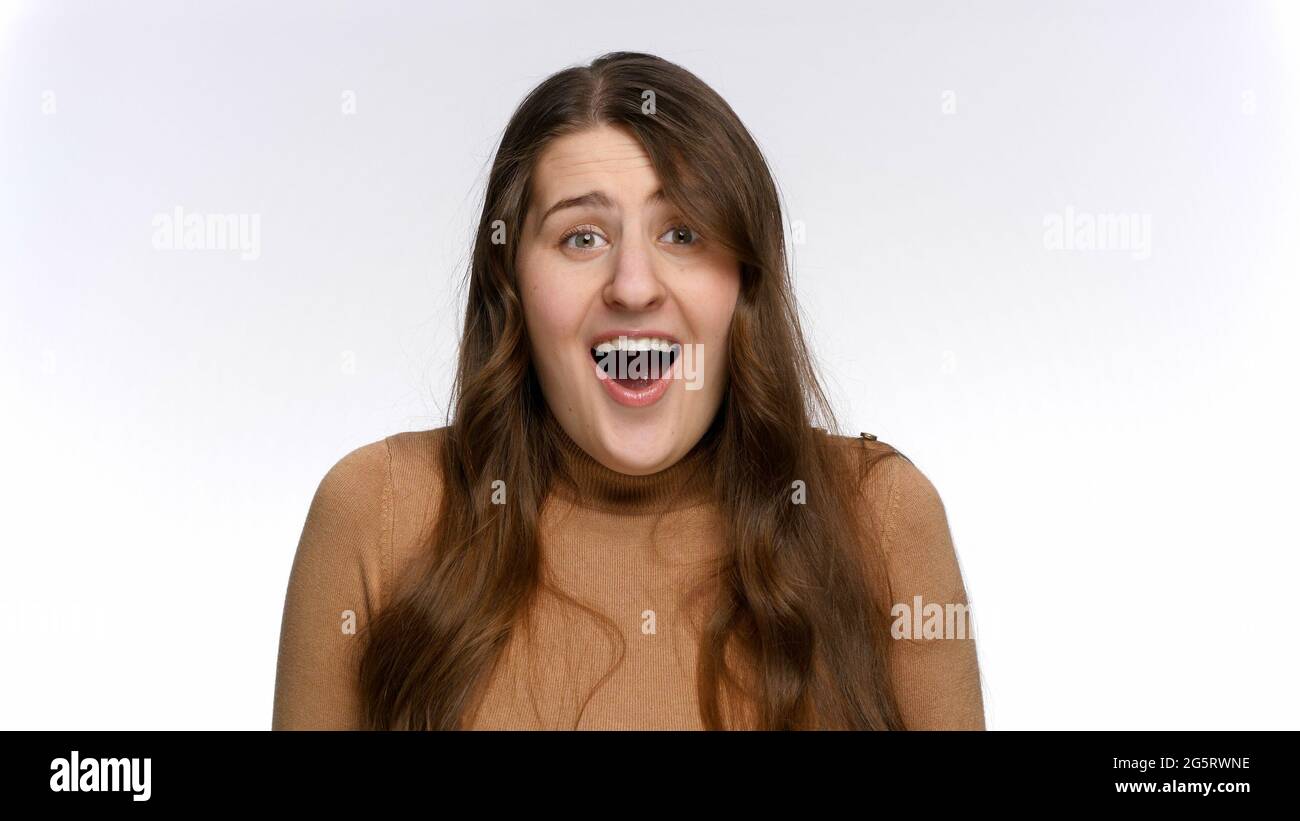 Positive laughing woman saying wow after getting amazed. Positive ...