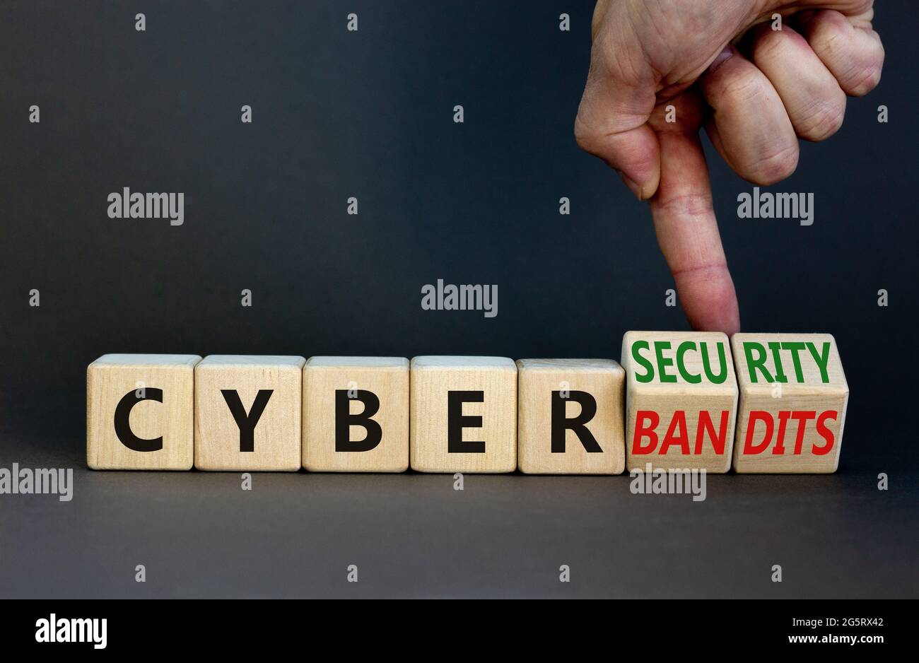 Cyber-security vs cyber-bandits symbol. Businessman turns wooden cubes ...