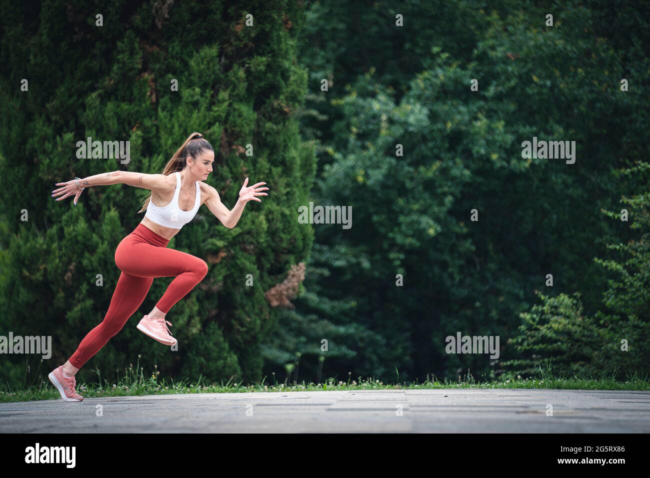 Athlete girl running, it is her lifestyle Stock Photo - Alamy