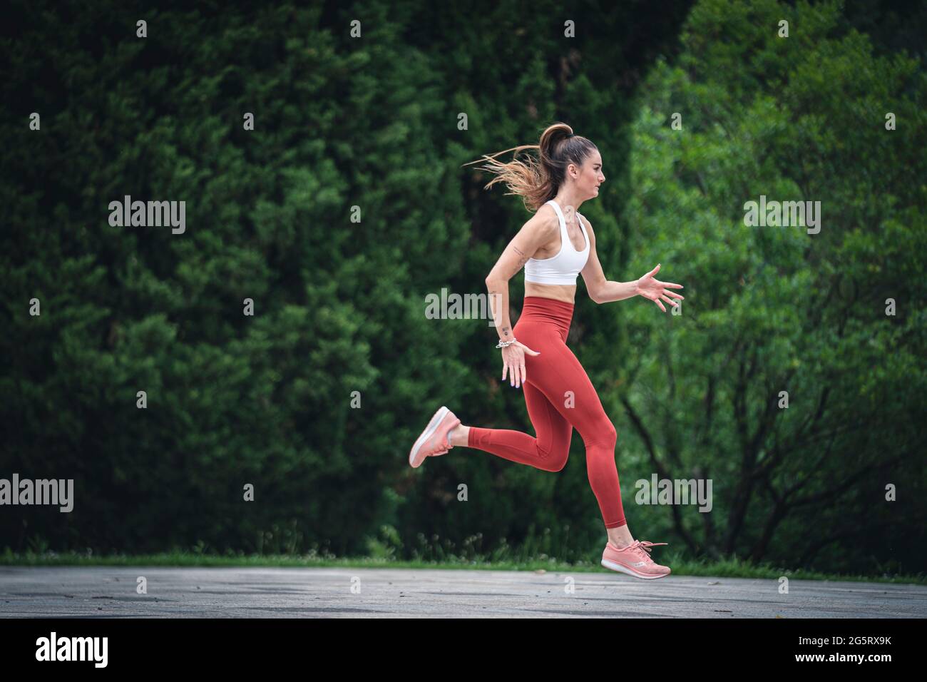 Athlete girl running, it is her lifestyle Stock Photo - Alamy