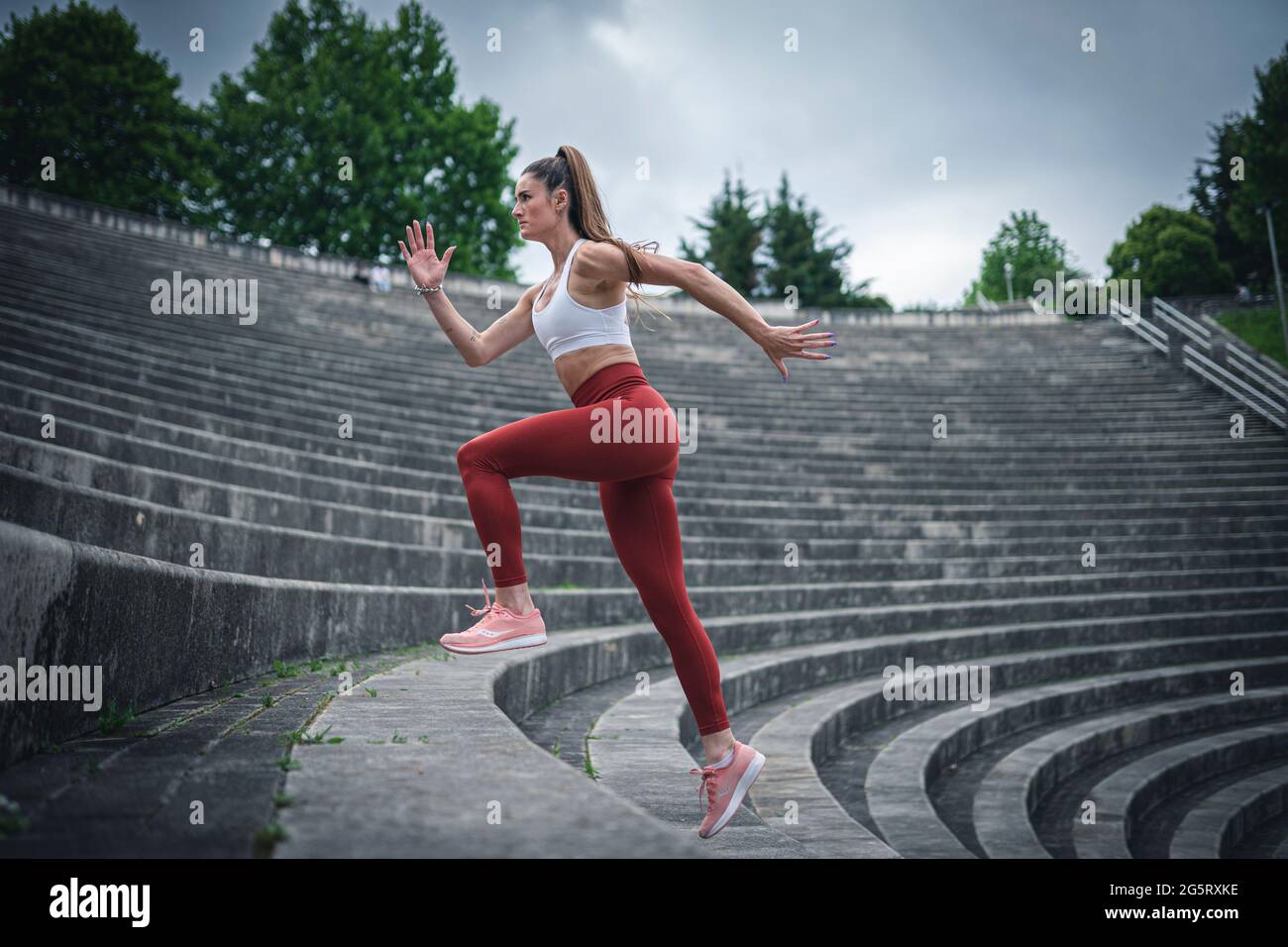Athlete girl doing running up stairs, it is her lifestyle Stock Photo ...