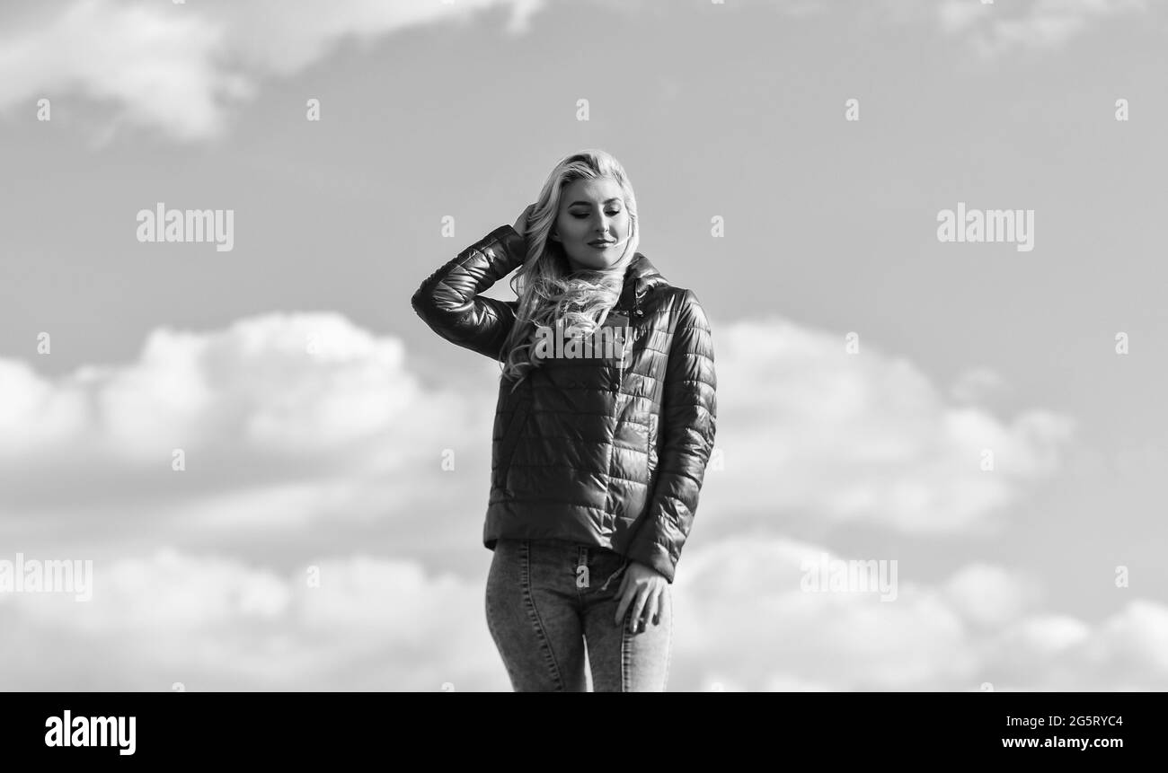 Female psychology. Girl red jacket cloudy sky. Wind of changes. Woman ...