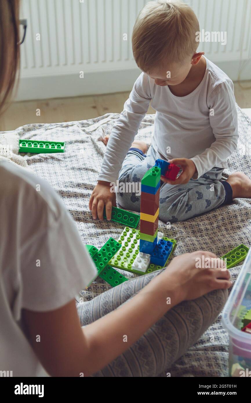 Child mom play together block hi-res stock photography and images - Alamy