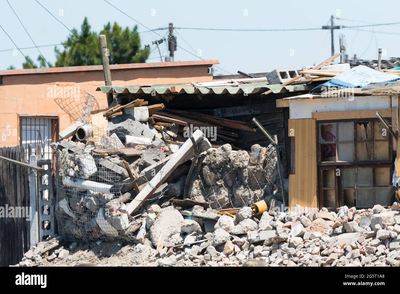 building rubble, construction debris, rubble, in front of a dilapidated ...