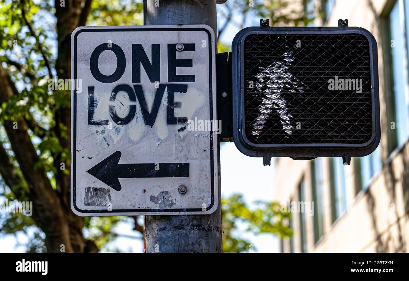 Creative one love sign. Altered road sign Stock Photo - Alamy