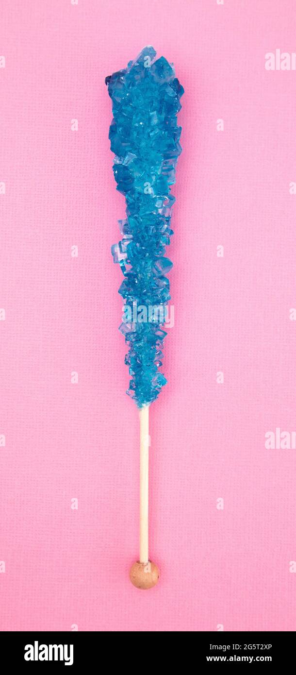 Sweet Blue Rock Candy on a Pink Background Stock Photo - Alamy