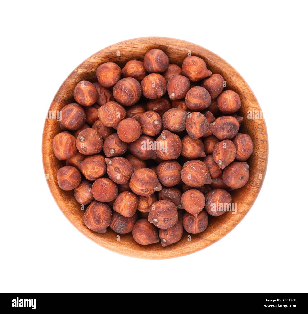 Pile of brown chickpeas in wooden bowl, isolated on white background ...