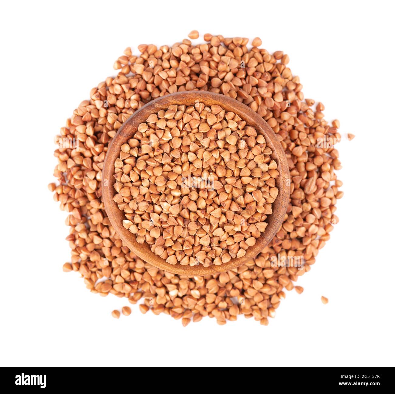 Roasted buckwheat grains in wooden bowl, isolated on white background ...